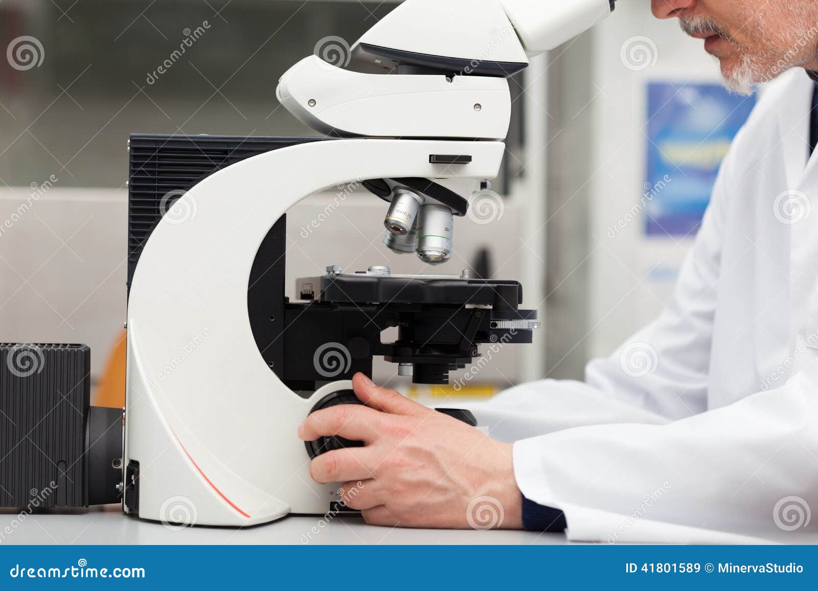 Man Using a Microscope in a Laboratory Stock Image - Image of chemical ...