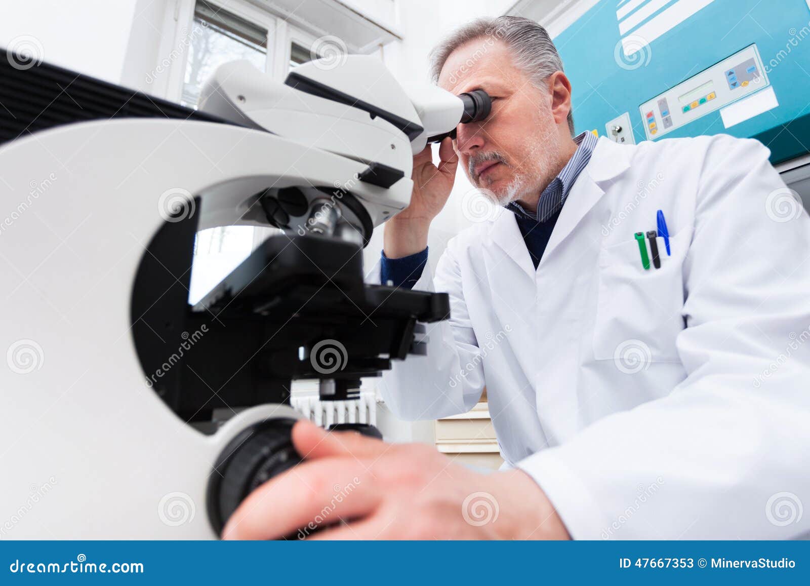 Man Using a Microscope in a Laboratory Stock Image - Image of chemistry ...
