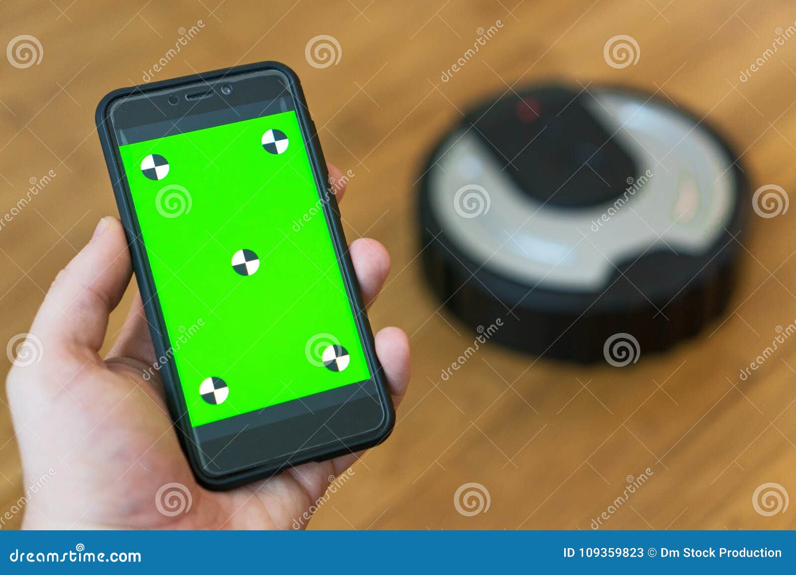 Man Using Mobile App To Control Robotic Vacuum Cleaner. Stock Image ...