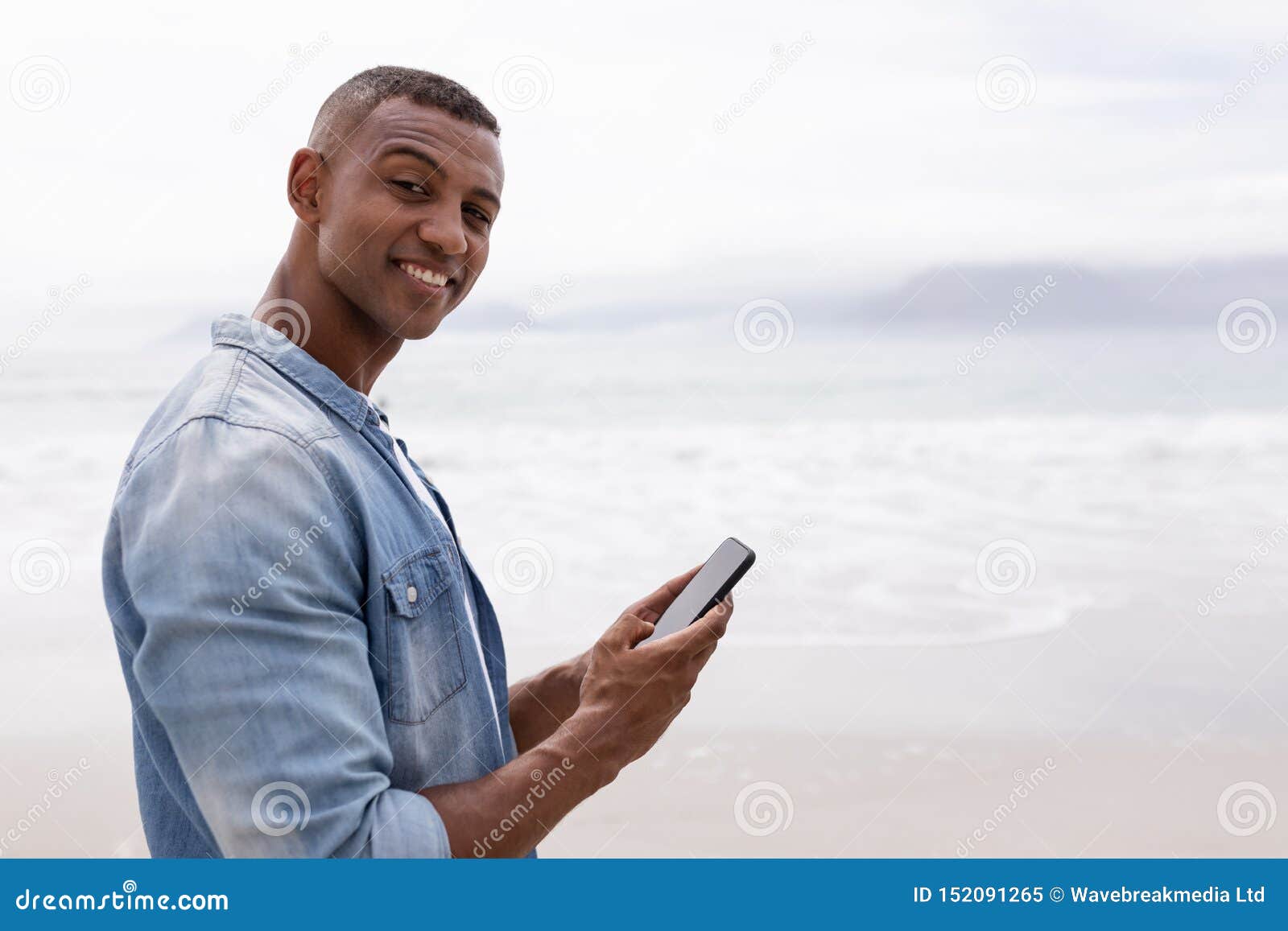 Man Using Mobile Phone on the Beach Stock Image - Image of cellphone ...