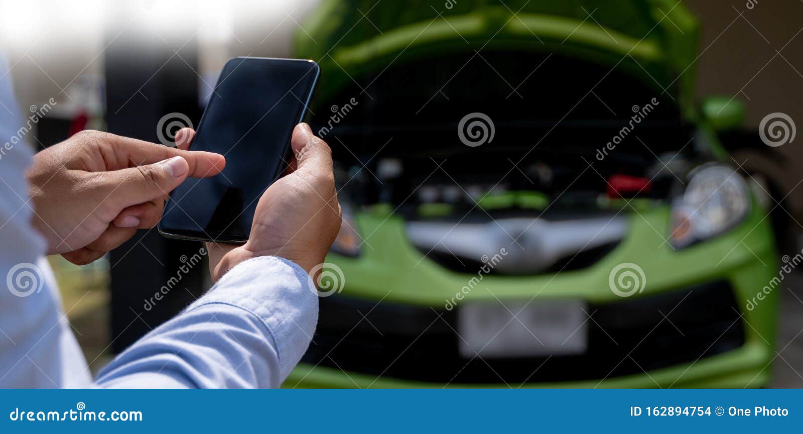Man Using a Mobile Phone Call To Assistance Help with a Broken Down Car ...