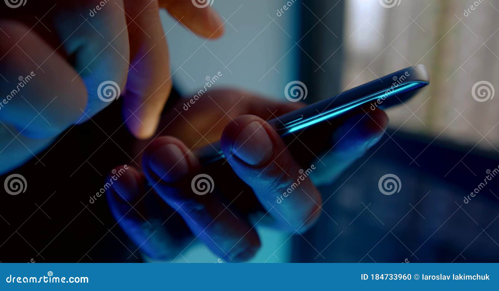 Man is Using Mobile Phone in Darkness, Tapping and Swiping on Screen ...