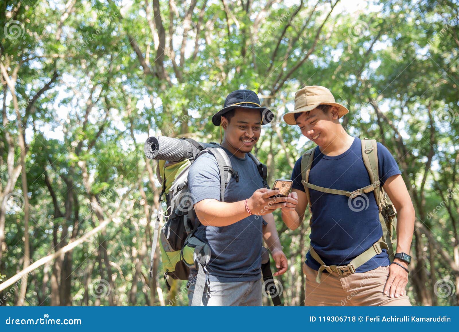 Man Using Mobile Phone in the Forest Stock Photo - Image of asian, male ...
