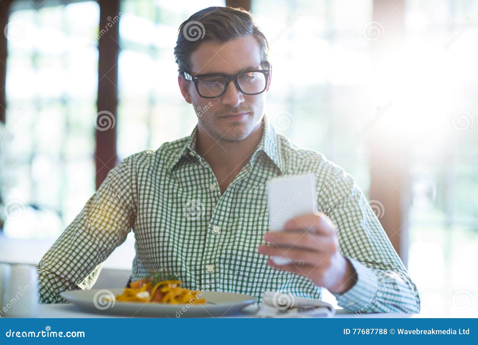 Man Using Mobile Phone while Having a Lunch Stock Photo - Image of ...