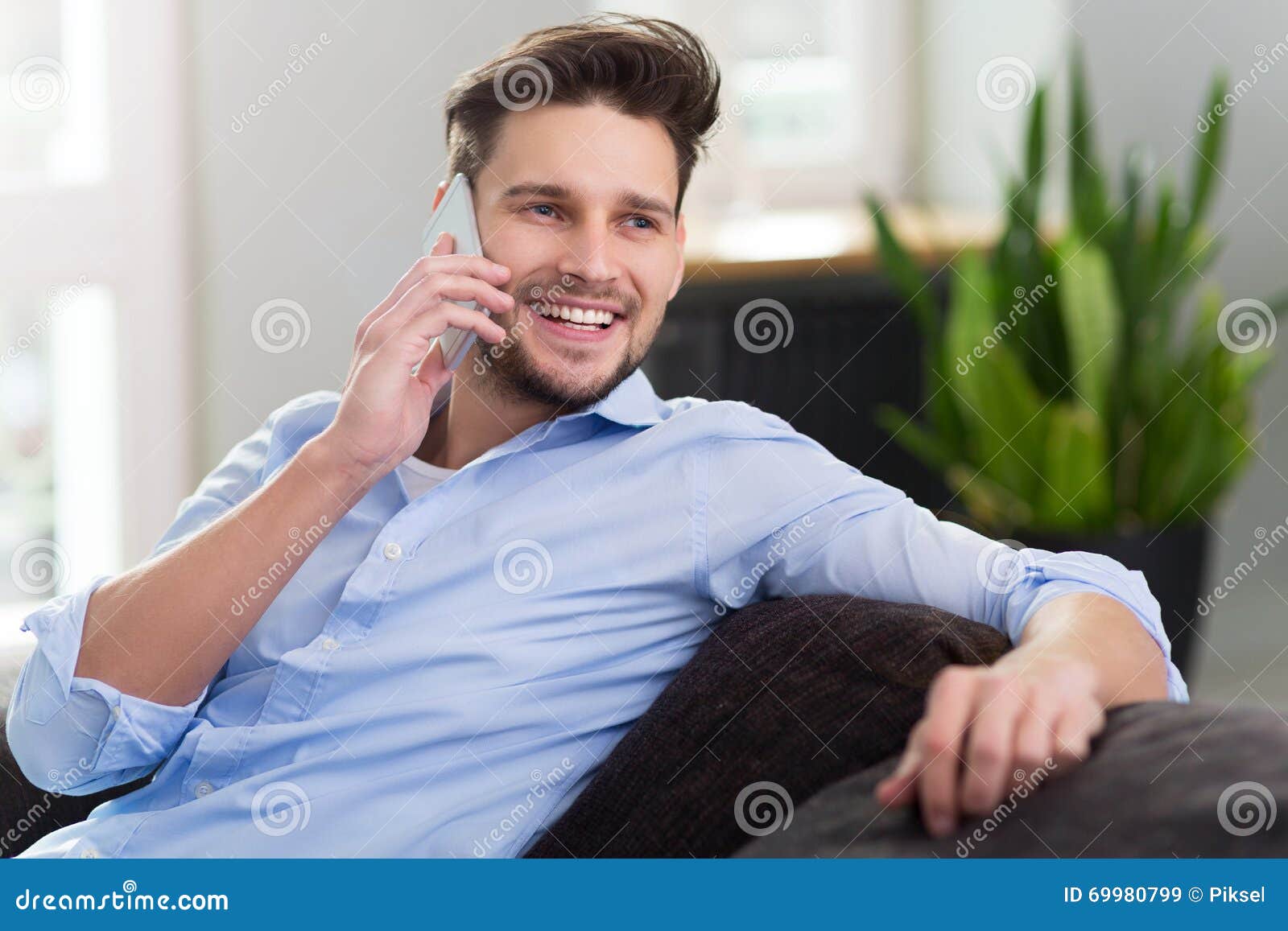Man Using Mobile Phone at Home Stock Image - Image of phone, male: 69980799
