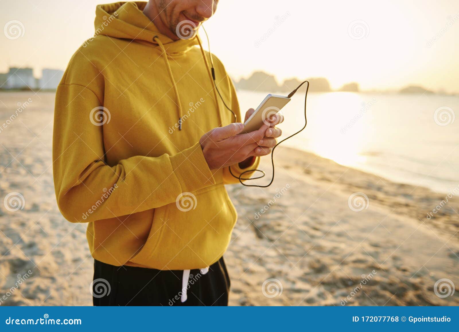Man Using Mobile Phone during Jogging Stock Photo - Image of horizontal ...