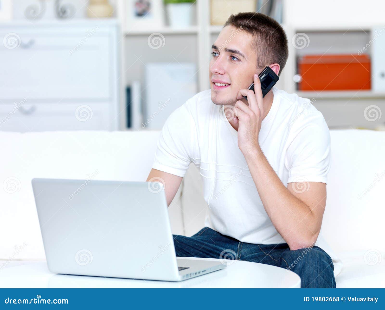 Man Using Mobile Phone and Laptop Stock Photo - Image of brunette ...