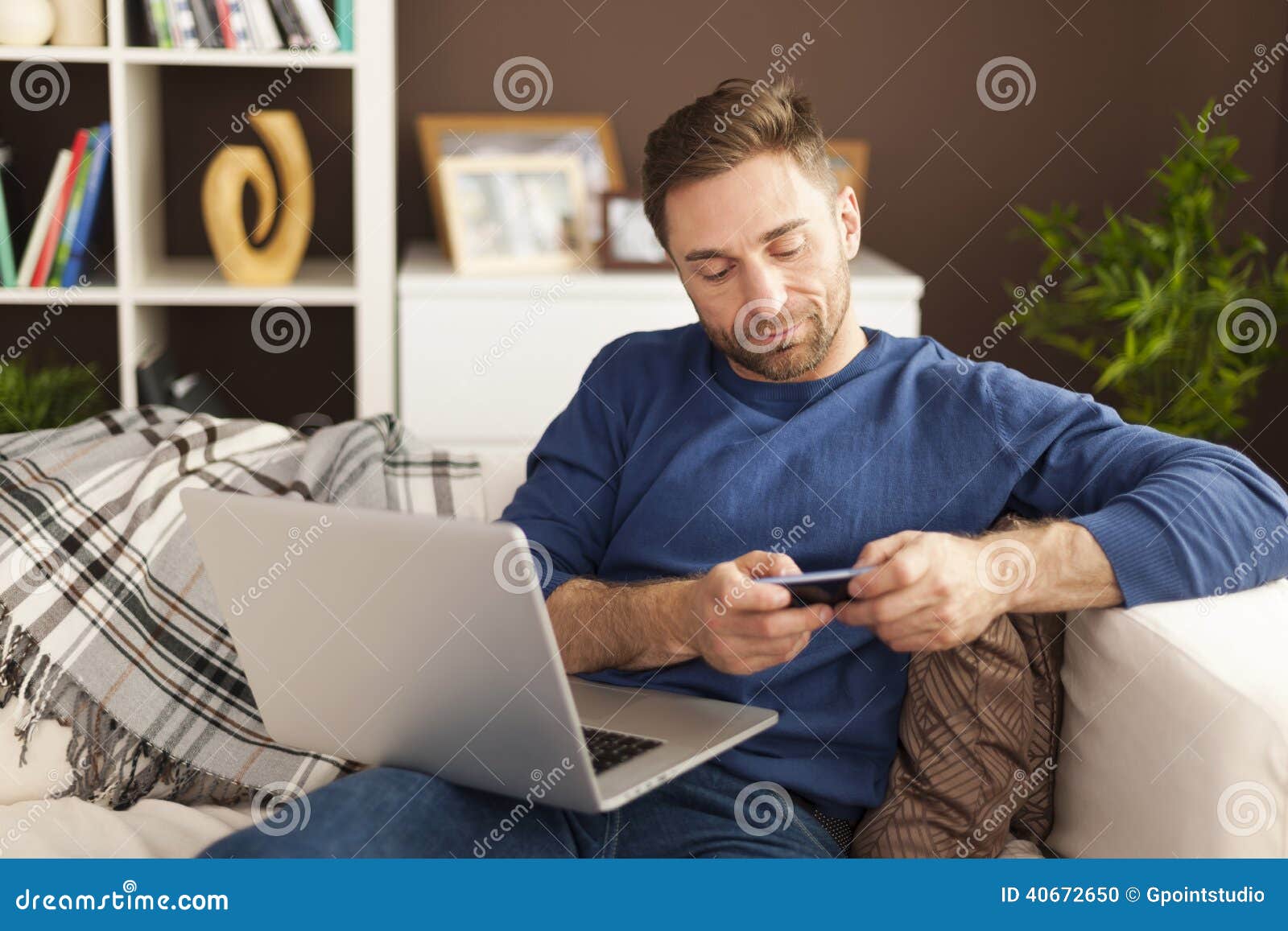 Man Using Mobile Phone and Laptop Stock Photo - Image of casual, room ...