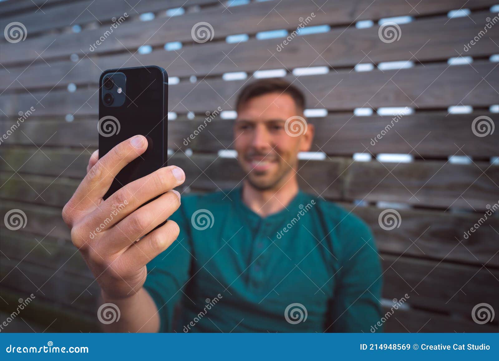 Man Using Mobile Phone. Looking at Smartphone and Having a Facetime ...