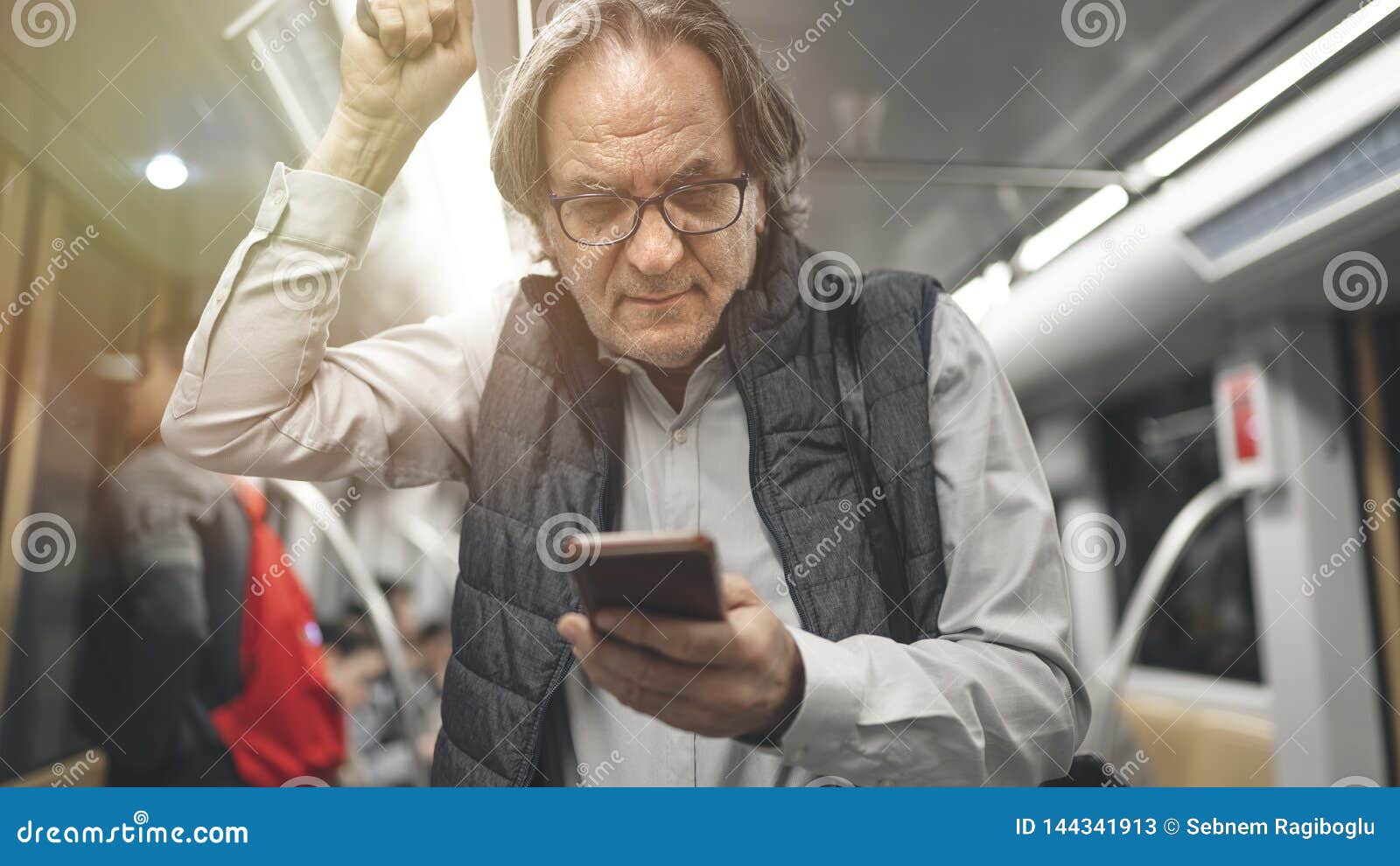 Man Using Mobile Phone in the Metro Train Stock Image - Image of person ...