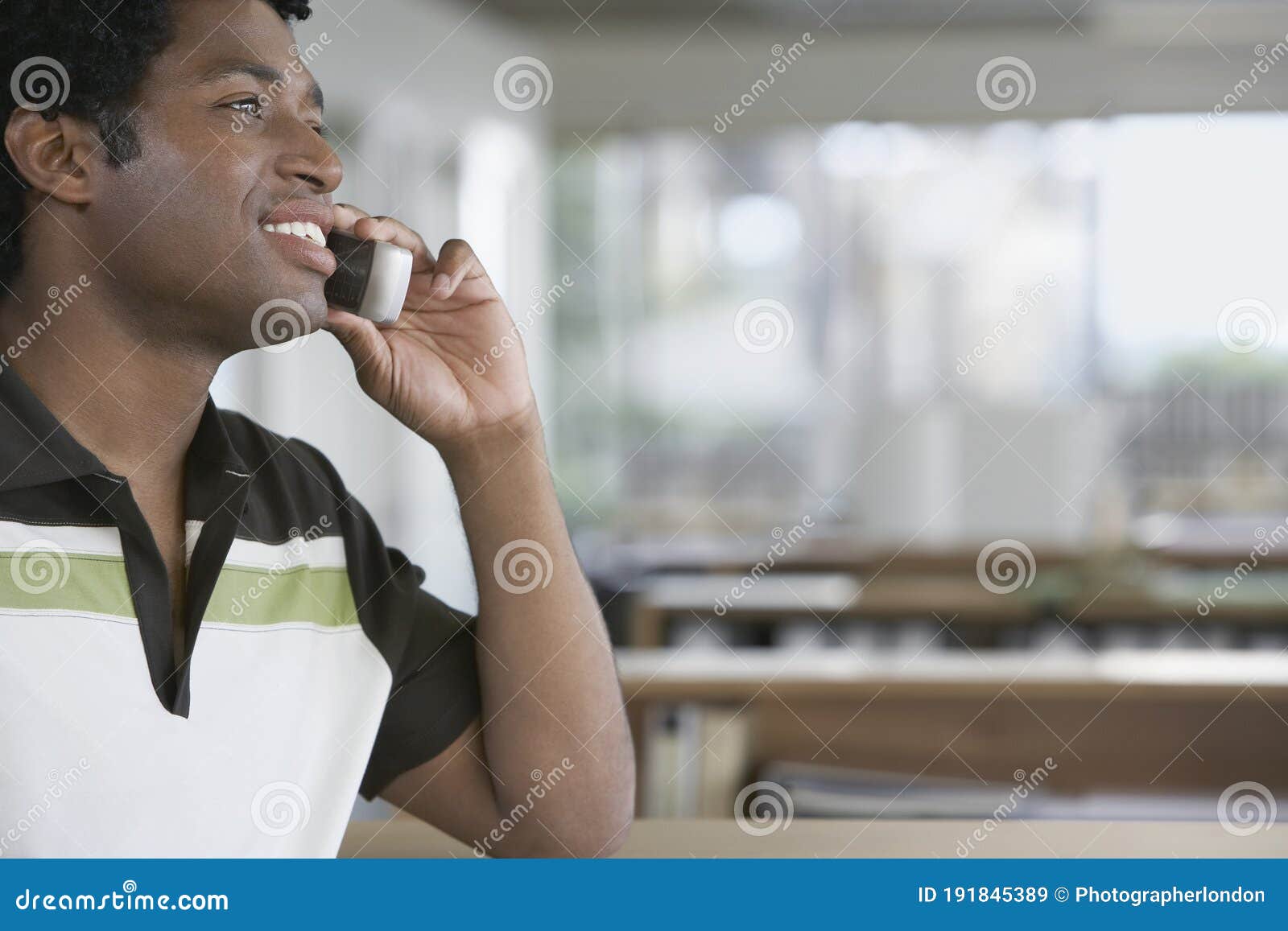 Man Using Mobile Phone in Office Stock Image - Image of smiling, office ...