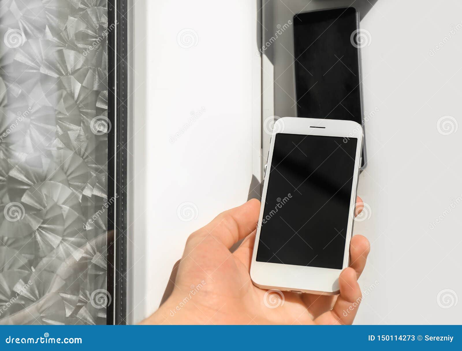 Man Using Mobile Phone for Opening Door Outdoors Stock Image - Image of ...