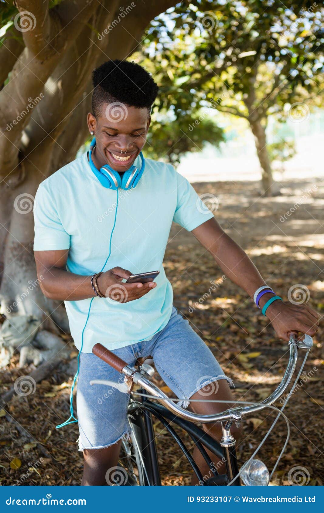 Man Using Mobile Phone while Riding His Bicycle Stock Image - Image of ...
