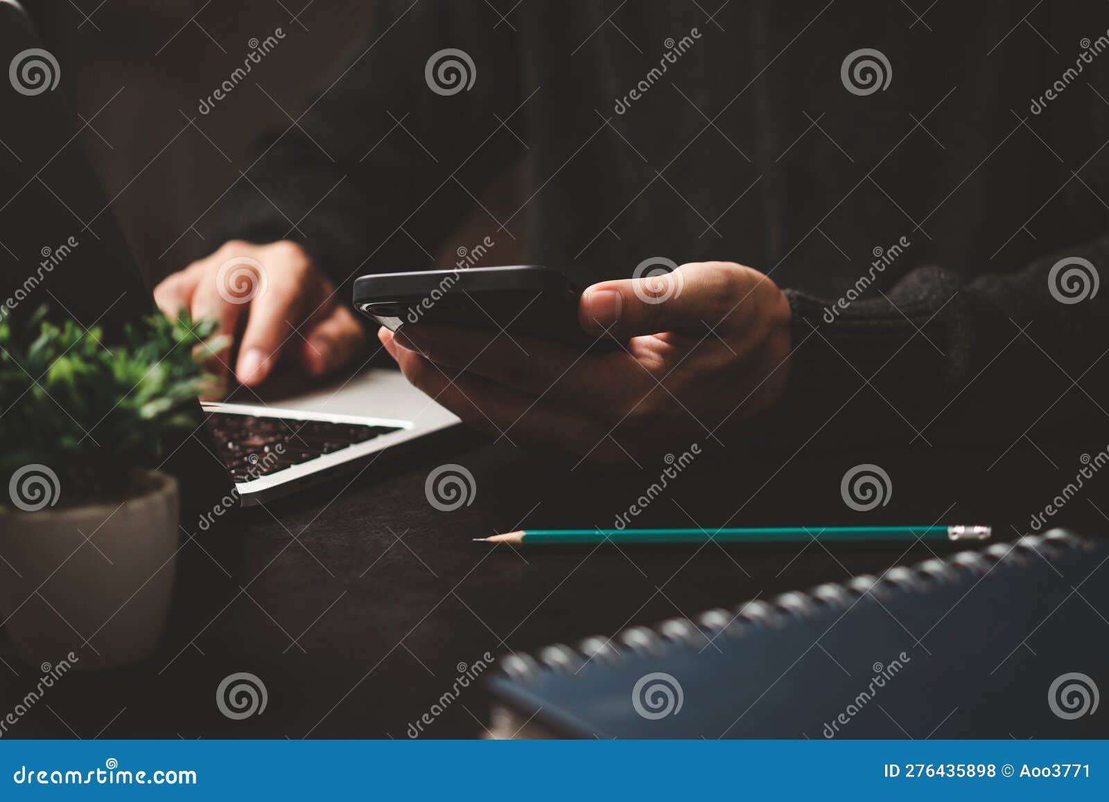 Man Using Mobile Smart Phone and Working on Laptop Computer.education ...