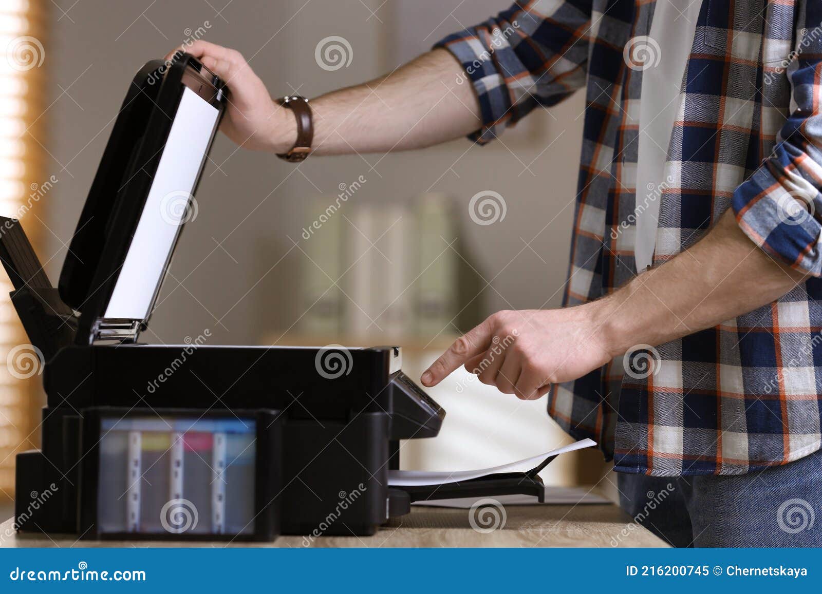 Man Using Modern Multifunction Printer in Office, Closeup Stock Image ...