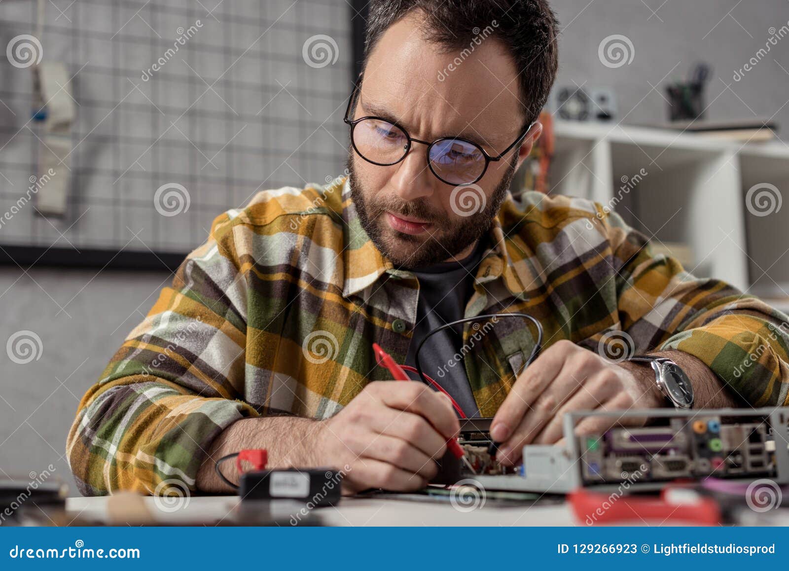 Man Using Multimeter while Fixing Broken Computer Stock Image - Image ...