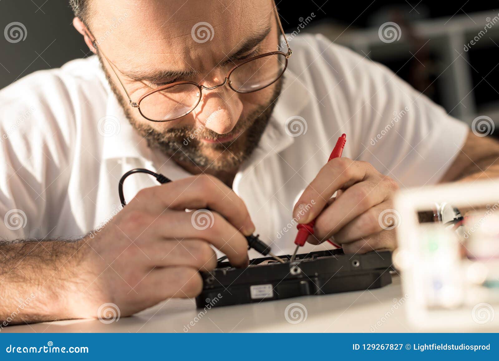 Man Using Multimeter while Testing Hard Disk Drive Stock Image - Image ...