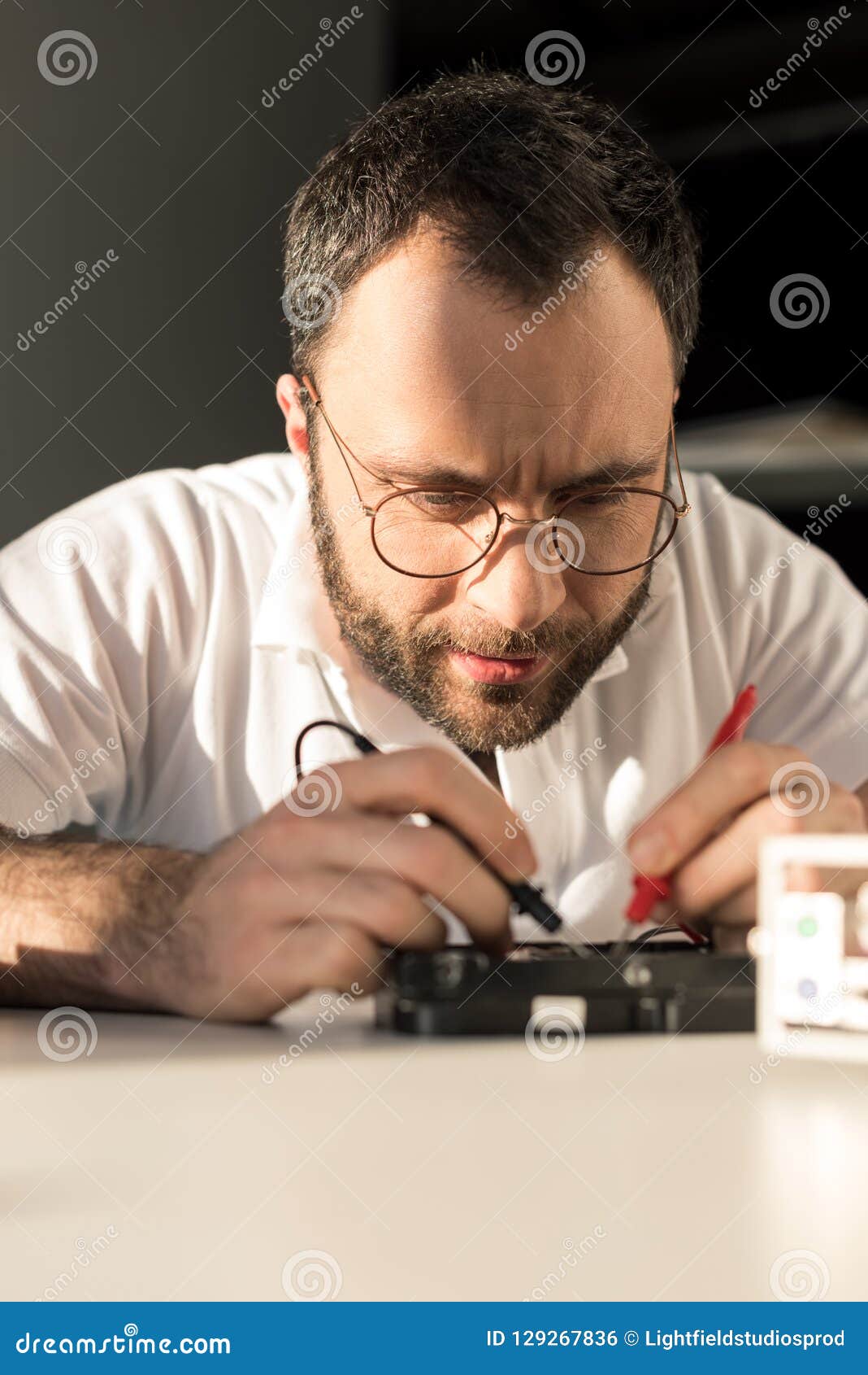Man Using Multimeter while Testing Hard Disk Drive Stock Photo - Image ...