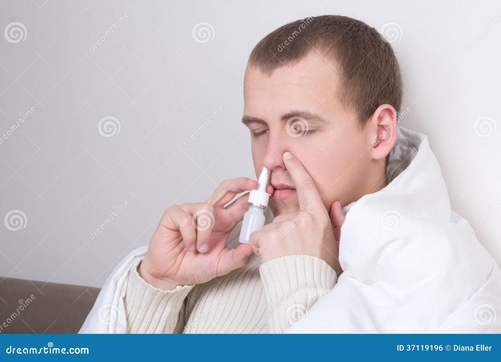 Man Using Nasal Spray in His Living Room Stock Photo - Image of male ...