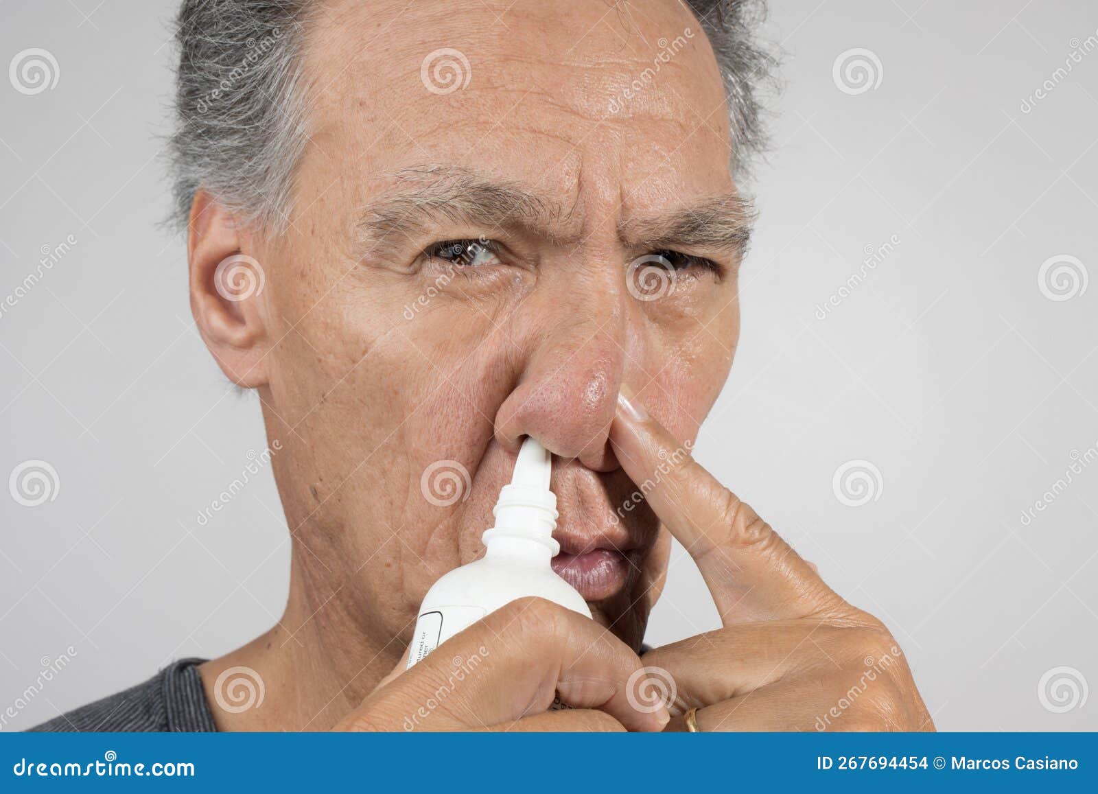 Man Using a Nasal Spray for His Nose Stock Photo - Image of treatment ...