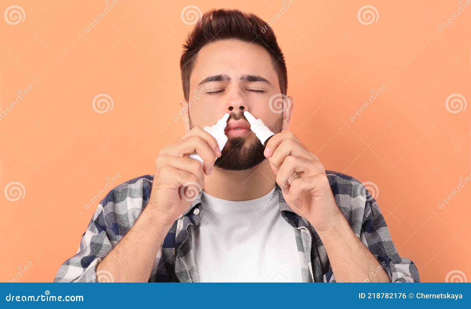 Man Using Nasal Sprays on Peach Background Stock Photo - Image of nose ...