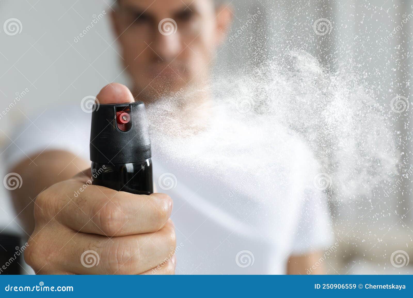 Man Using Pepper Spray at Home, Focus on Hand Stock Image - Image of ...