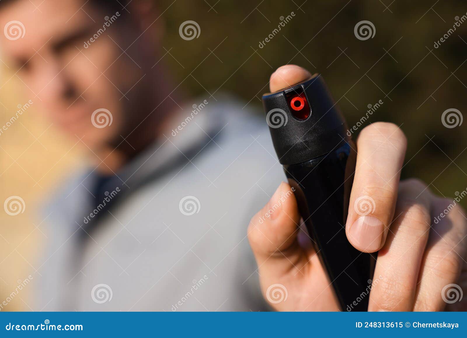 Man Using Pepper Spray Outdoors, Focus on Hand. Space for Text Stock ...