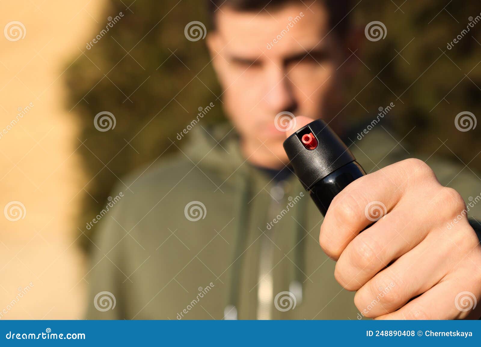 Man Using Pepper Spray Outdoors, Focus on Hand. Space for Text Stock ...