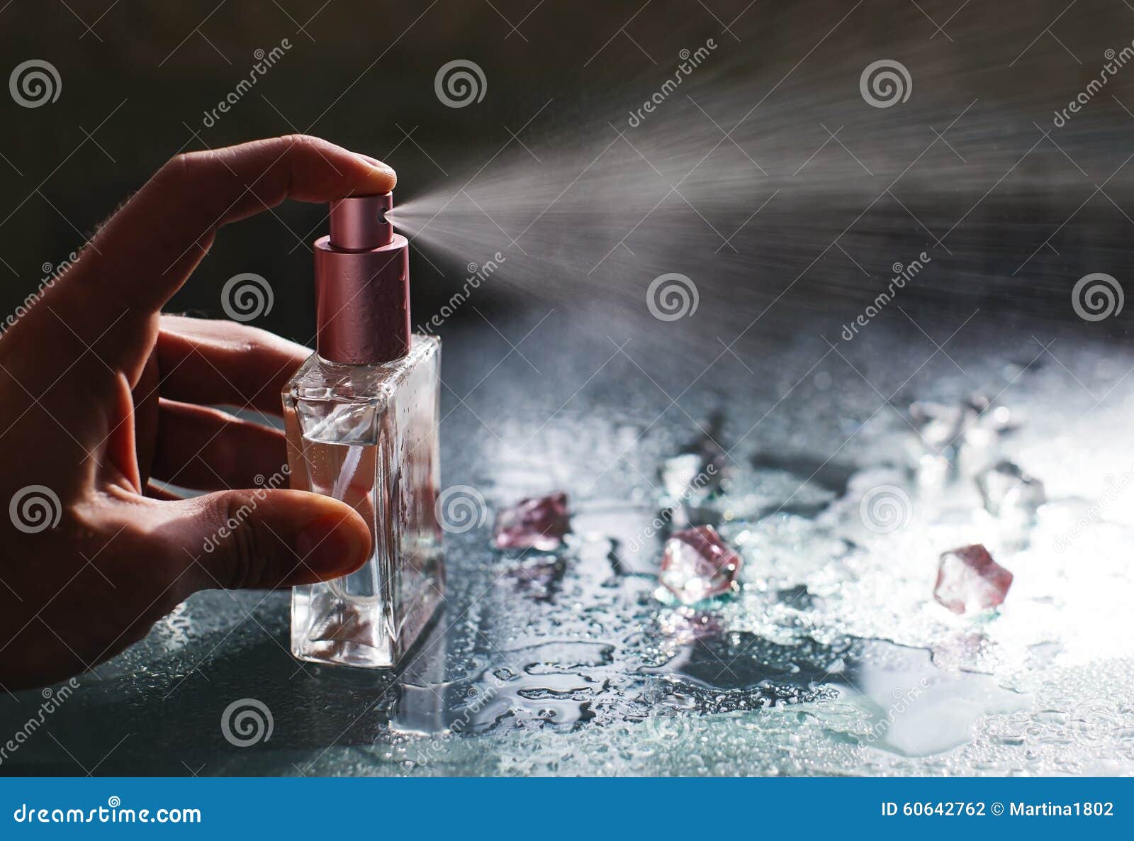 Man using perfume stock photo. Image of hold, beauty - 60642762