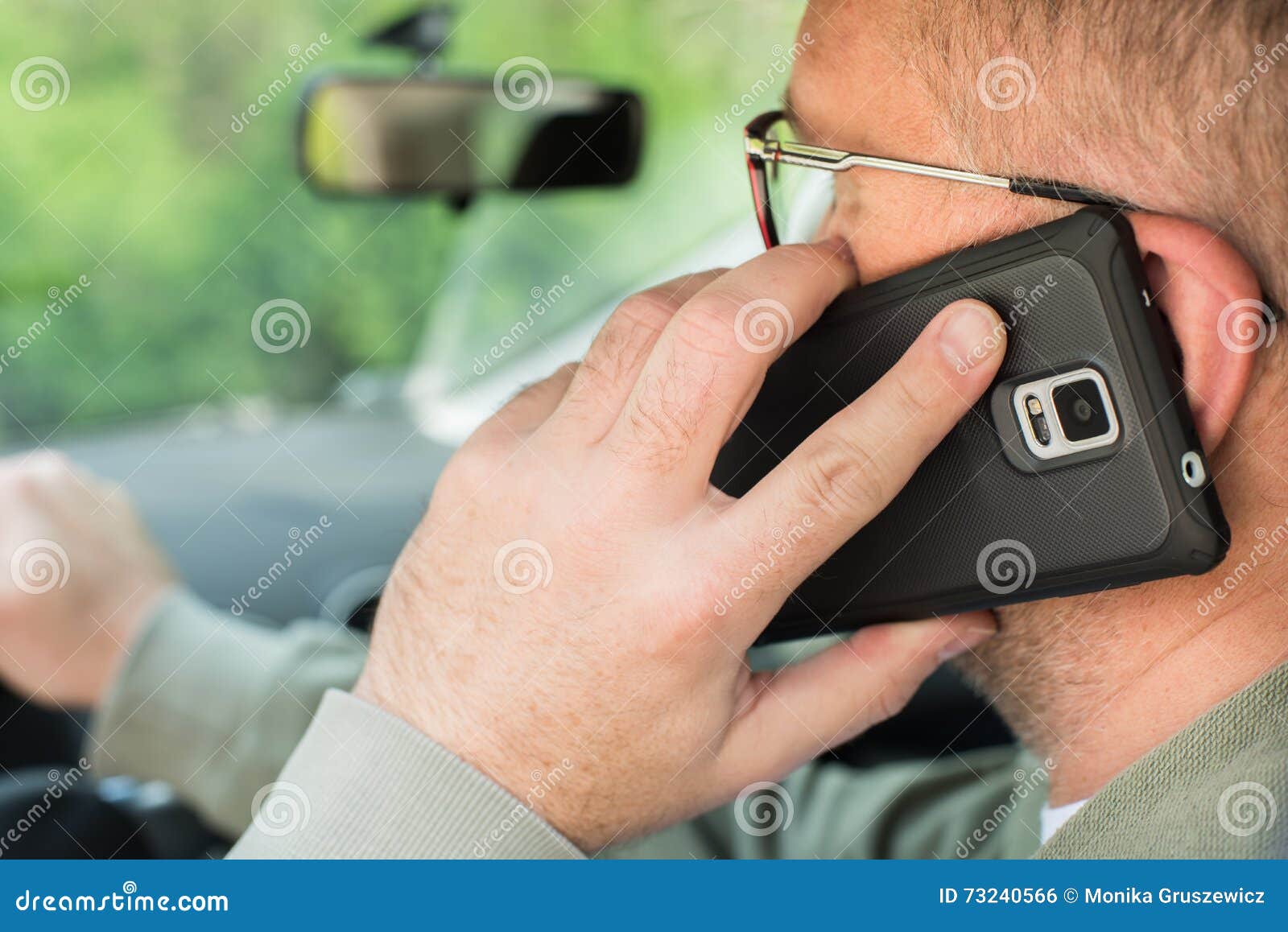 Man Using Phone while Driving Stock Photo - Image of smartphone, phone ...
