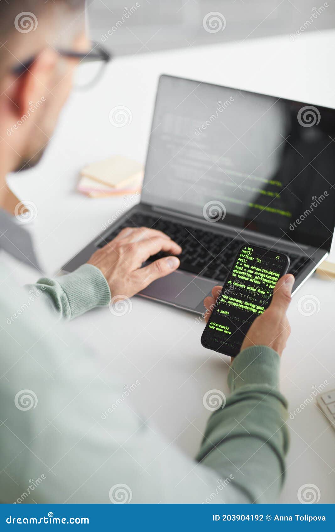 Man using phone at work stock photo. Image of manager - 203904192