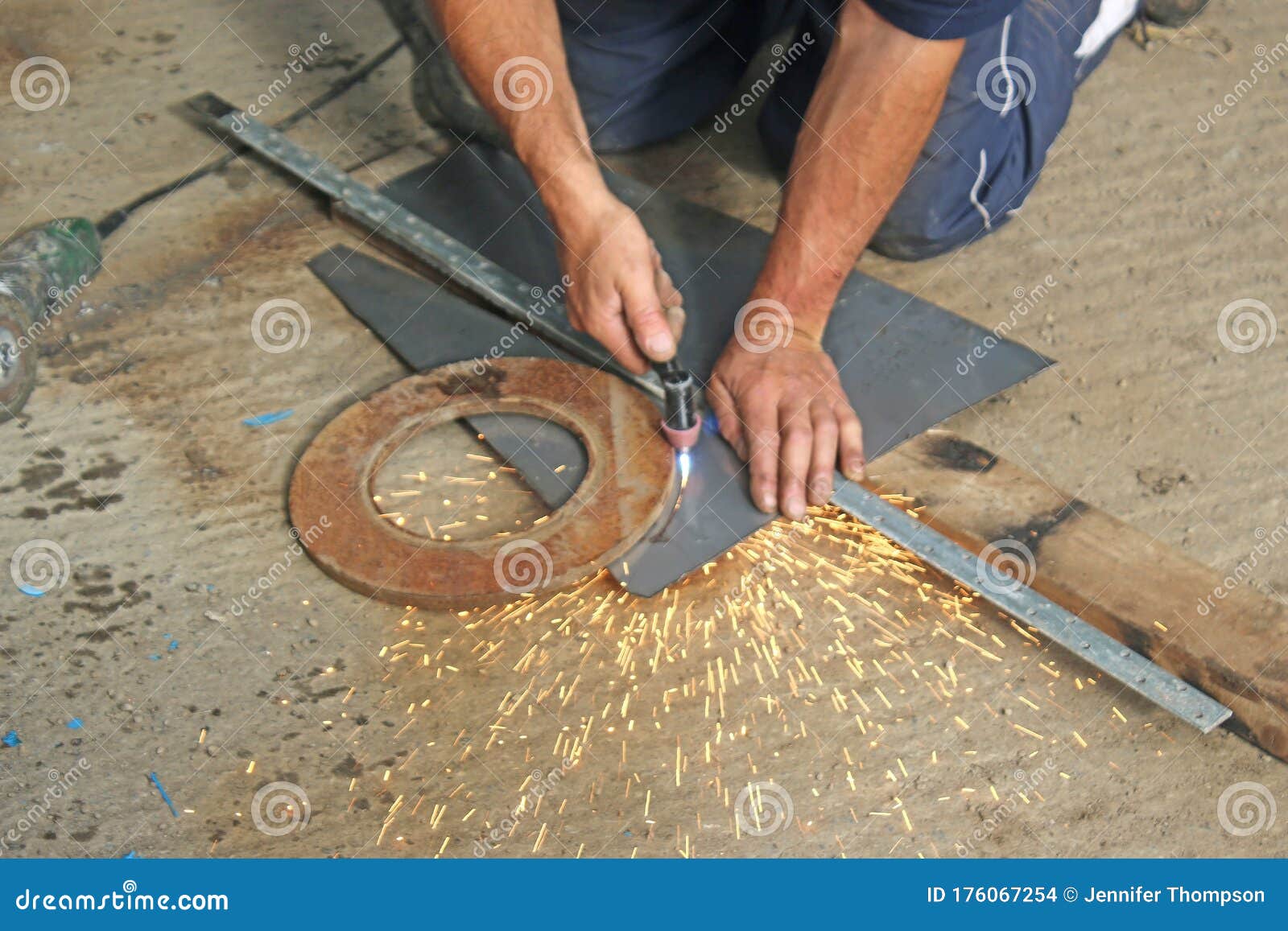 Man using a plasma cutter stock photo. Image of work - 176067254