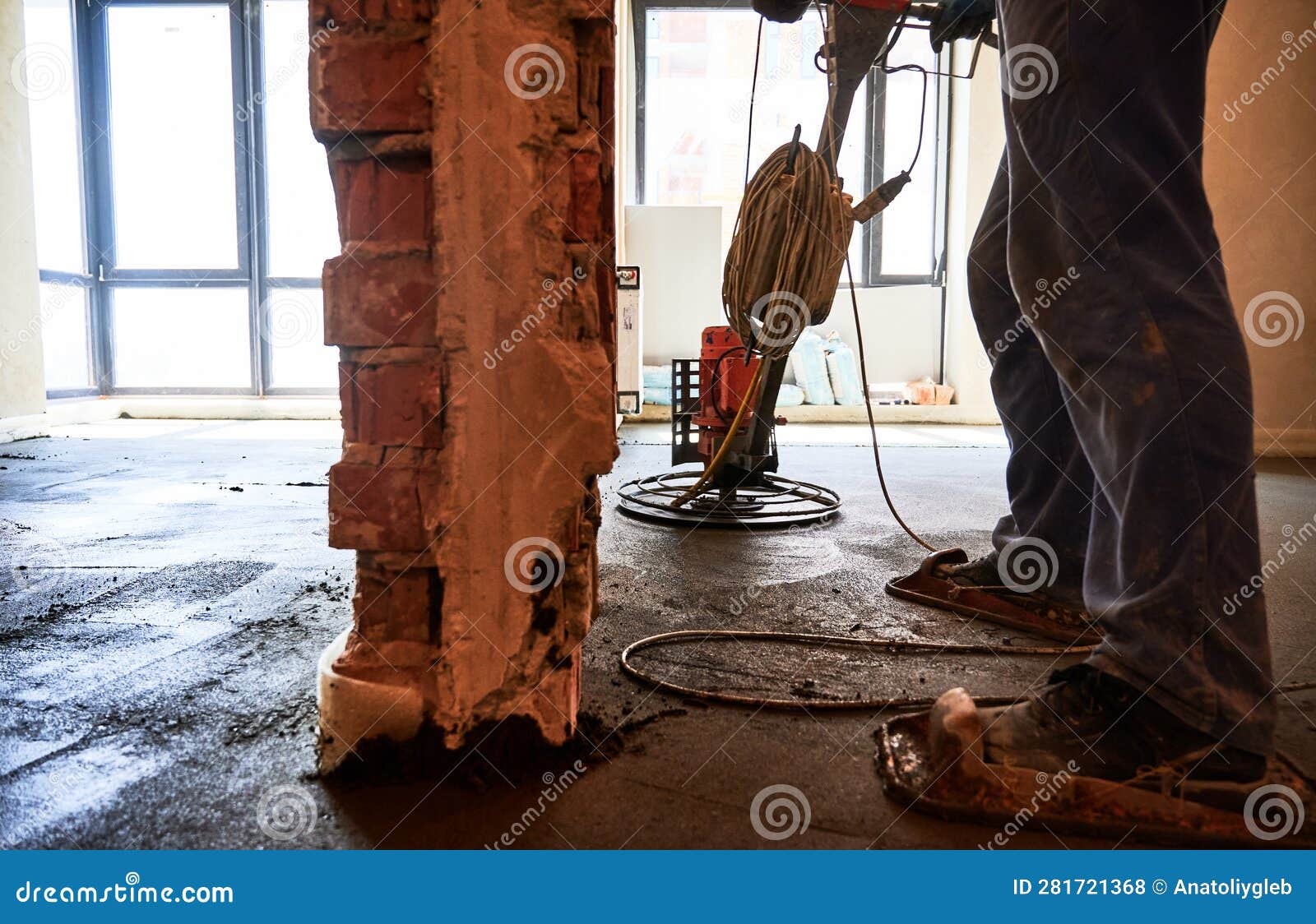 Man Using Power Trowel Machine at Construction Site. Stock Photo ...