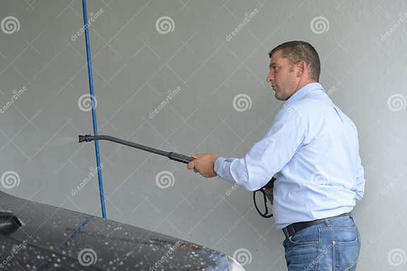 Man using power washer stock photo. Image of spray, labor - 121232414