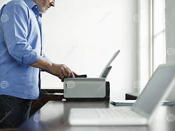 Man Using Printer at Study Table in House Stock Photo - Image of people ...