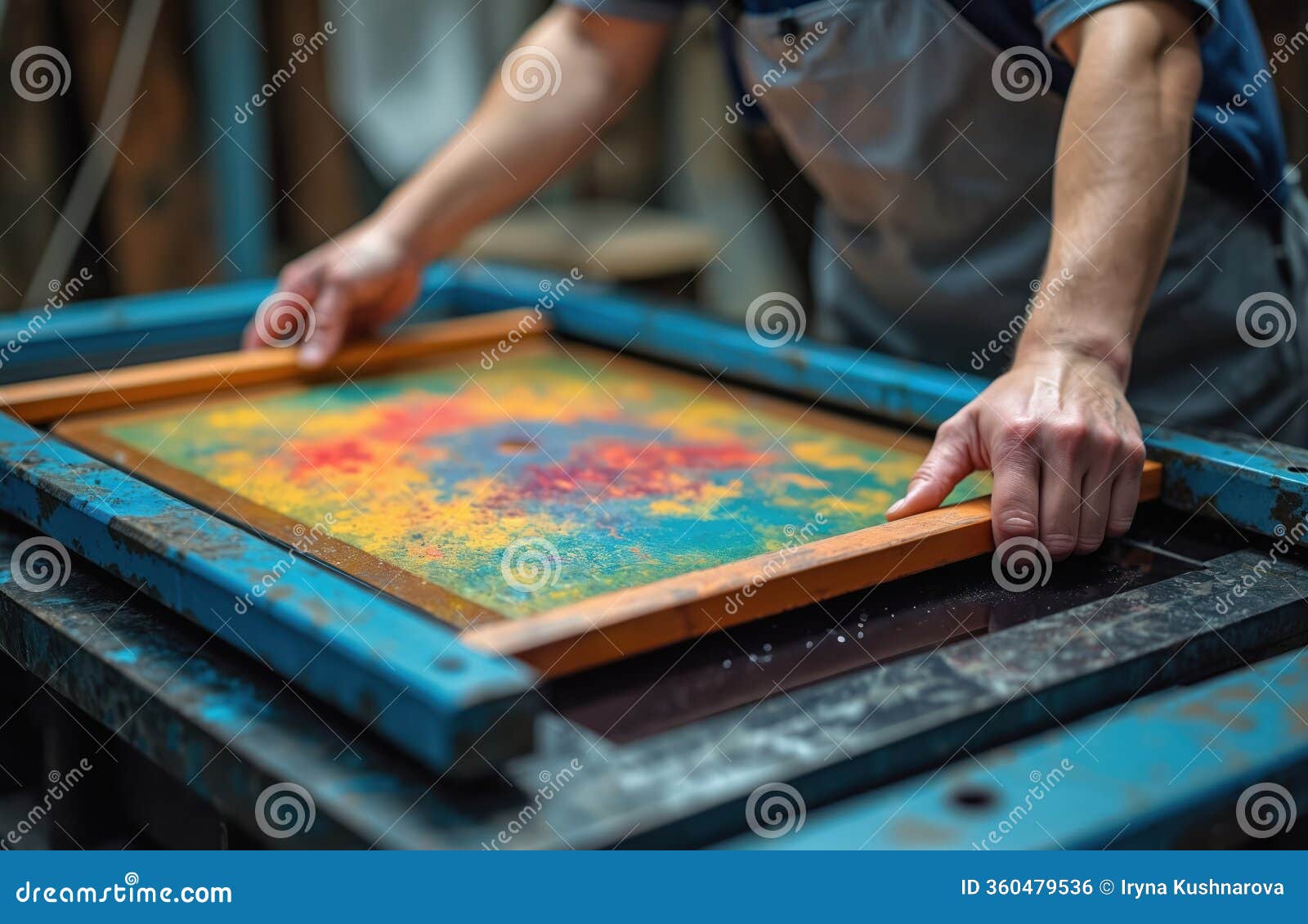 Man Using Printing Machine in Workshop. Male Worker Pressing Colorful ...