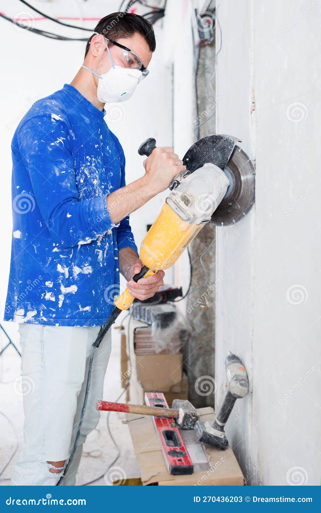 Man Using Professional Angle Grinder for Cutting Wall Stock Image ...