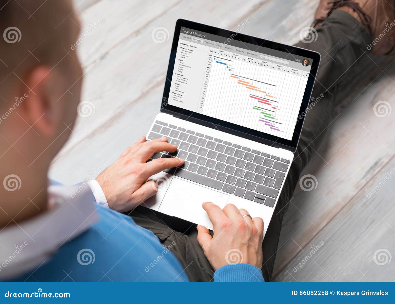 Man Using Project Management Software on Laptop Computer Stock Photo ...