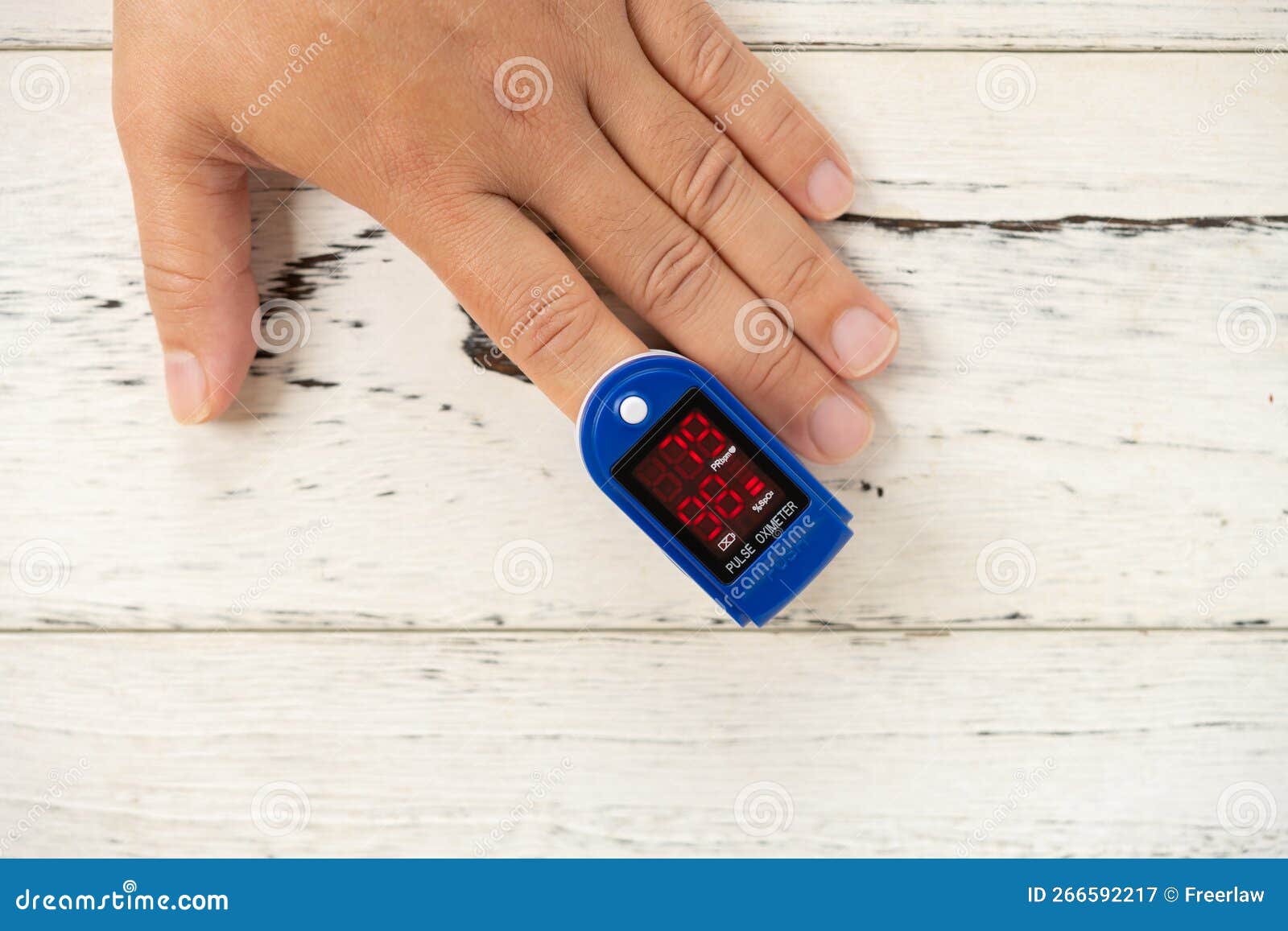 Man Using Pulse Oximeter on His Left Index Finger Horizontal ...