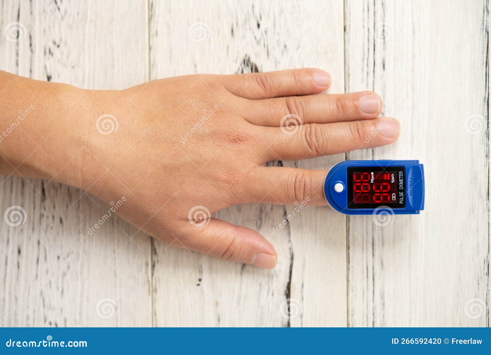 Man Using Pulse Oximeter on His Left Index Finger Horizontal ...