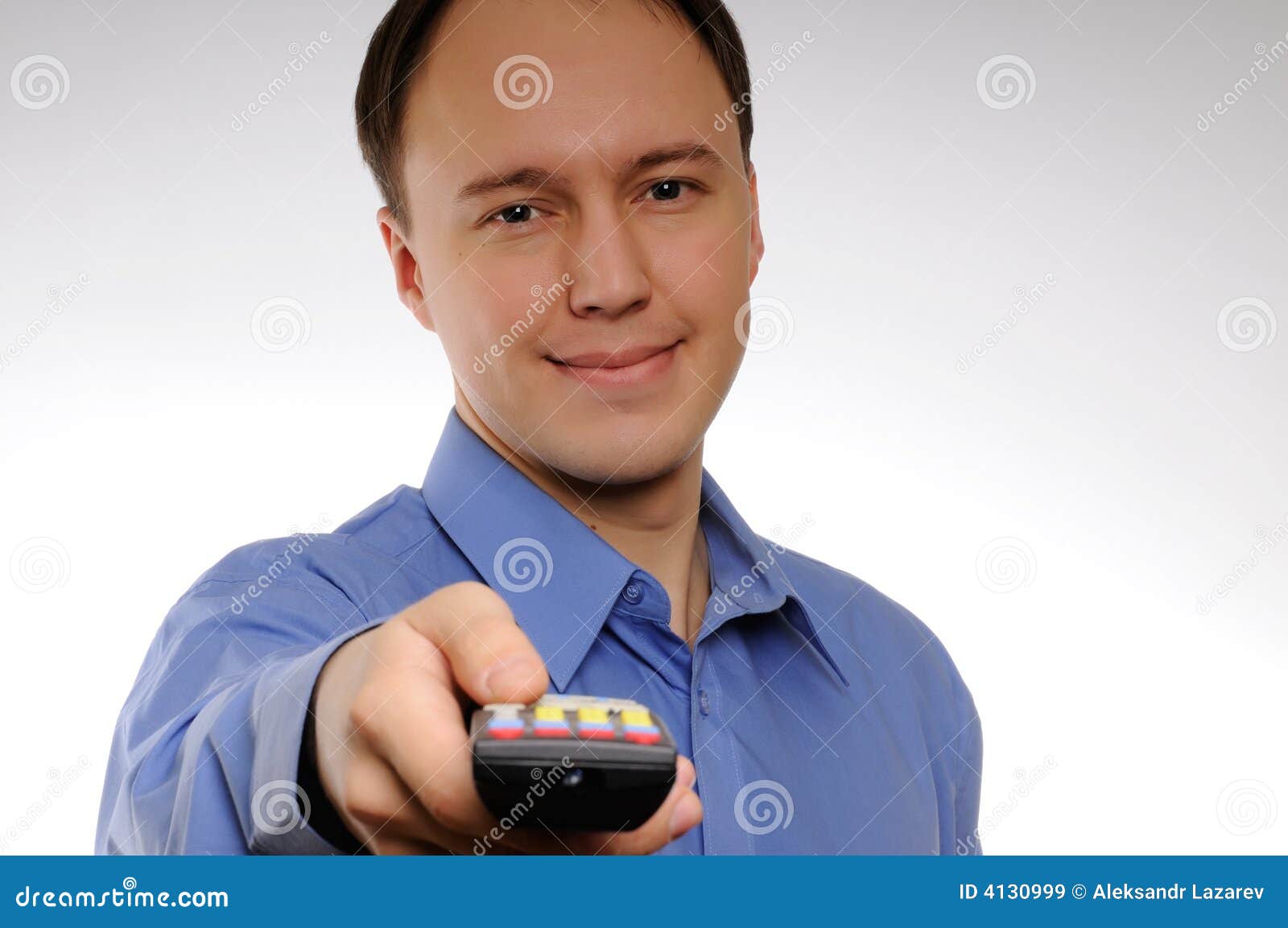 Man using remote stock image. Image of smile, shirt, press - 4130999
