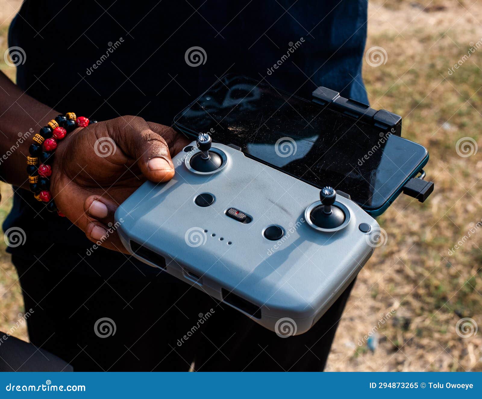 A Man Using a Remote Control To Fly a Drone Stock Image - Image of ...