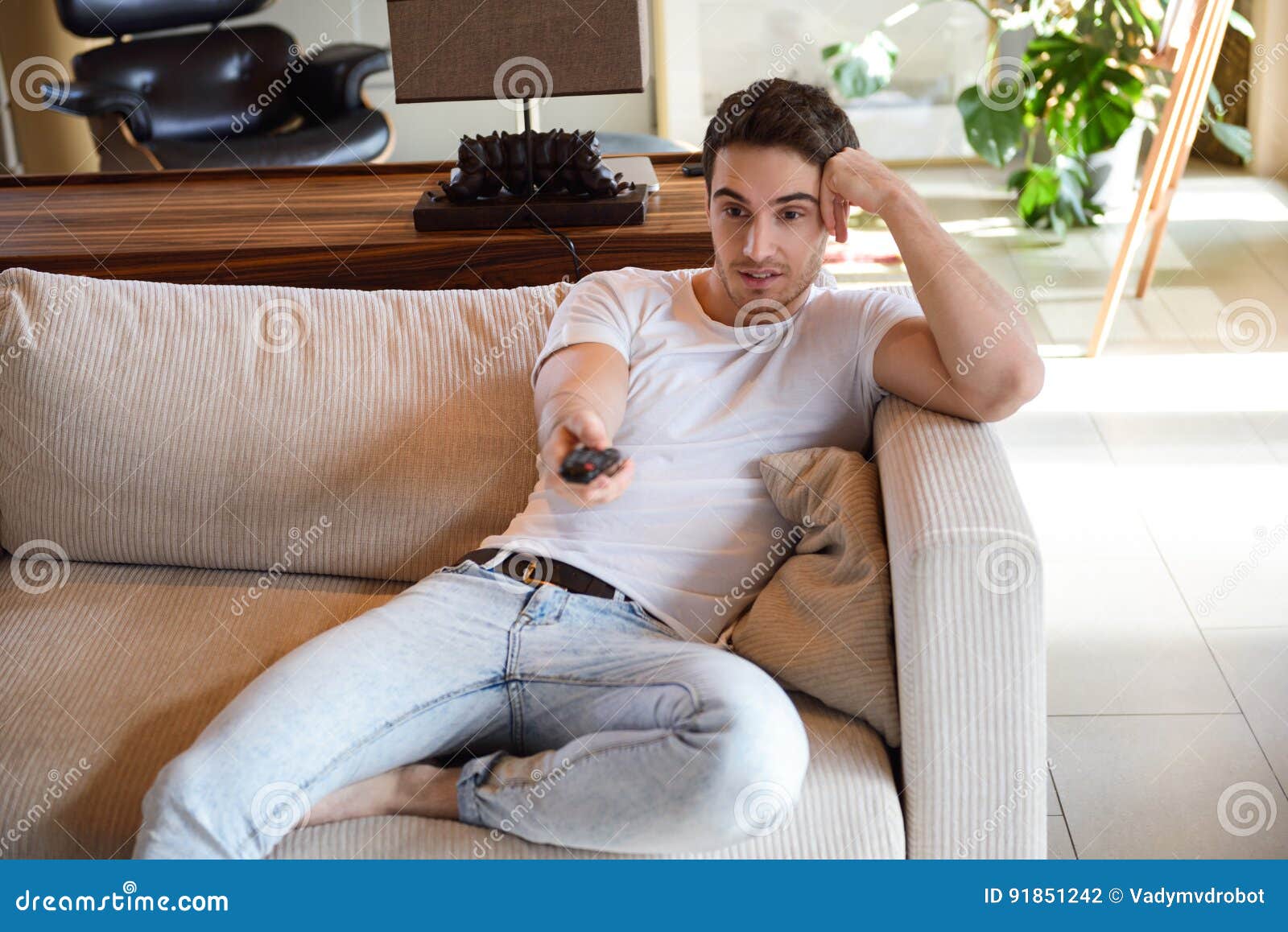 Man Using Remote Controller Stock Photo - Image of living, point: 91851242