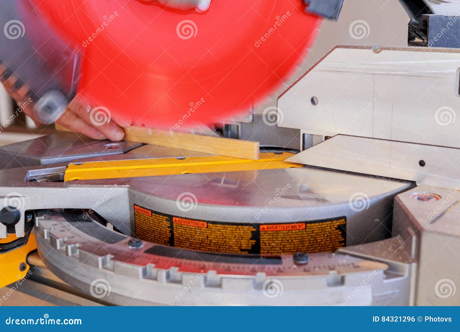 Man using saw to cut wood stock photo. Image of worker - 84321296