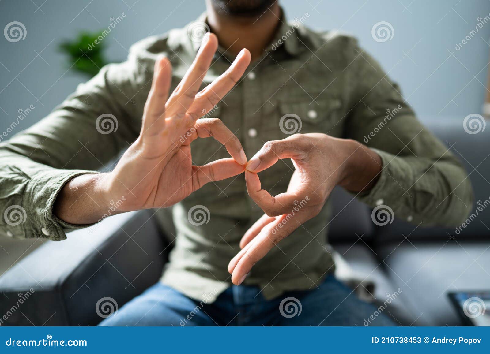 Man Using Sign Language To Communicate Against Stock Image - Image of ...