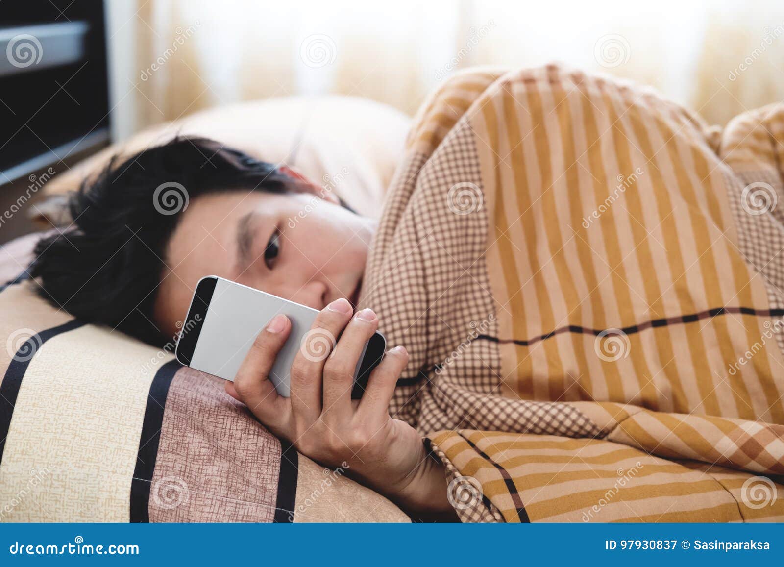 A Man Using Smart Phone in the Morning, Checking Message after Waking ...