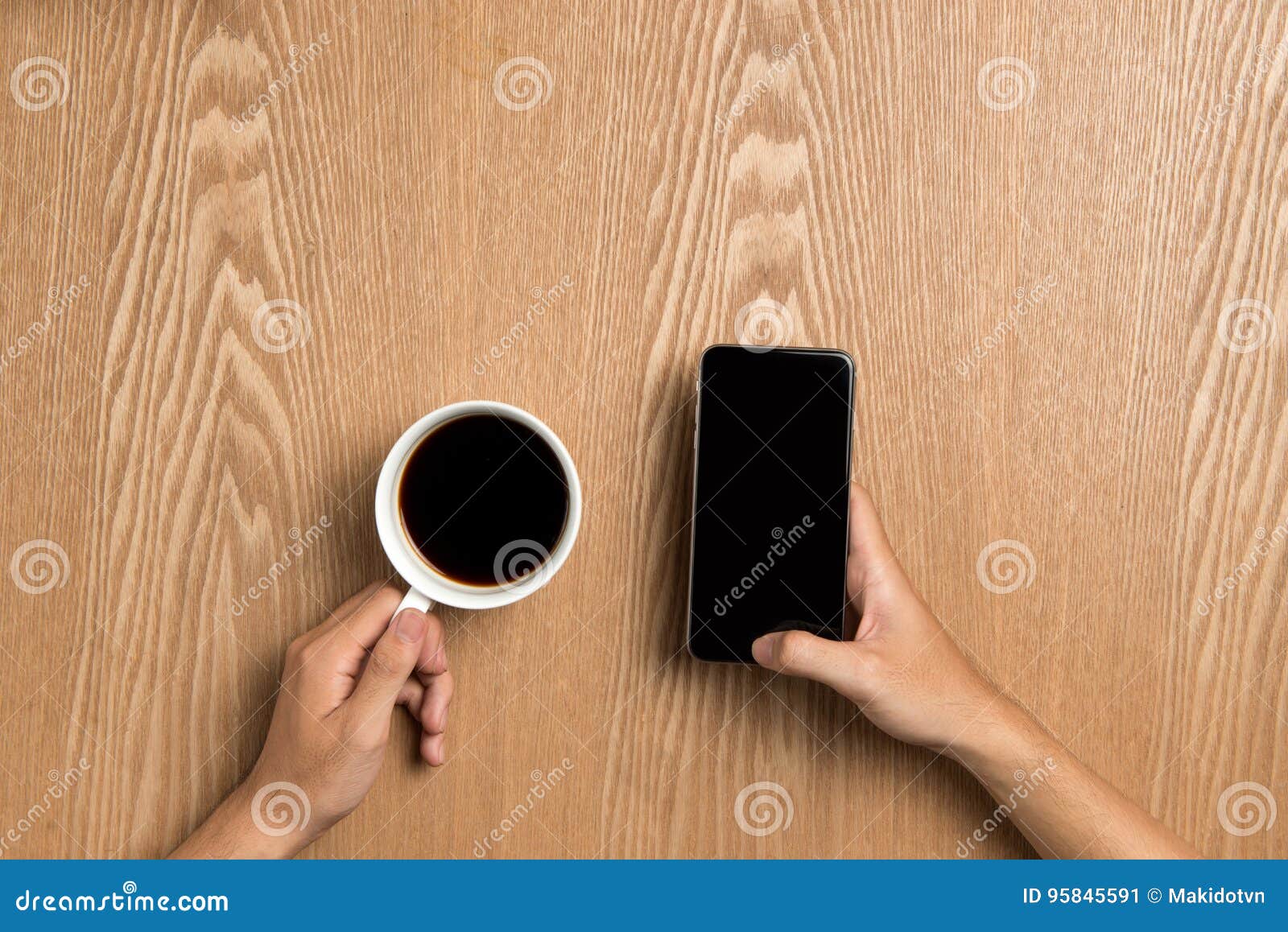 Man Using Smart Phone Sitting on Table, Hand Holding Smart Phone Stock ...