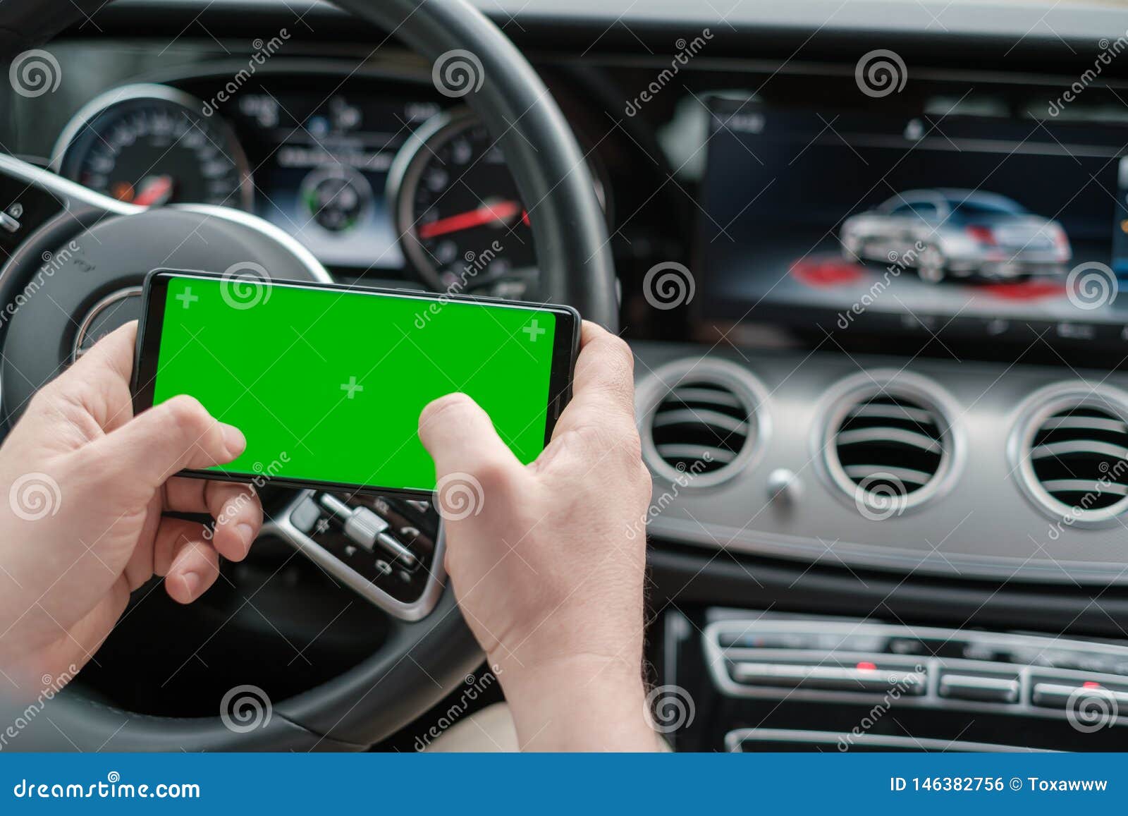 Man Using Smartphone on the Background of a Luxury Class Car Dashboard ...