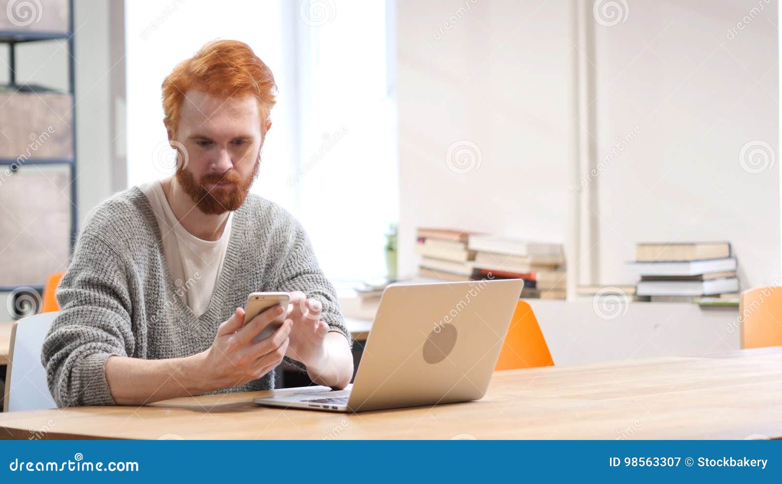 Man Using Smartphone, Browsing Online at Work Stock Image - Image of ...