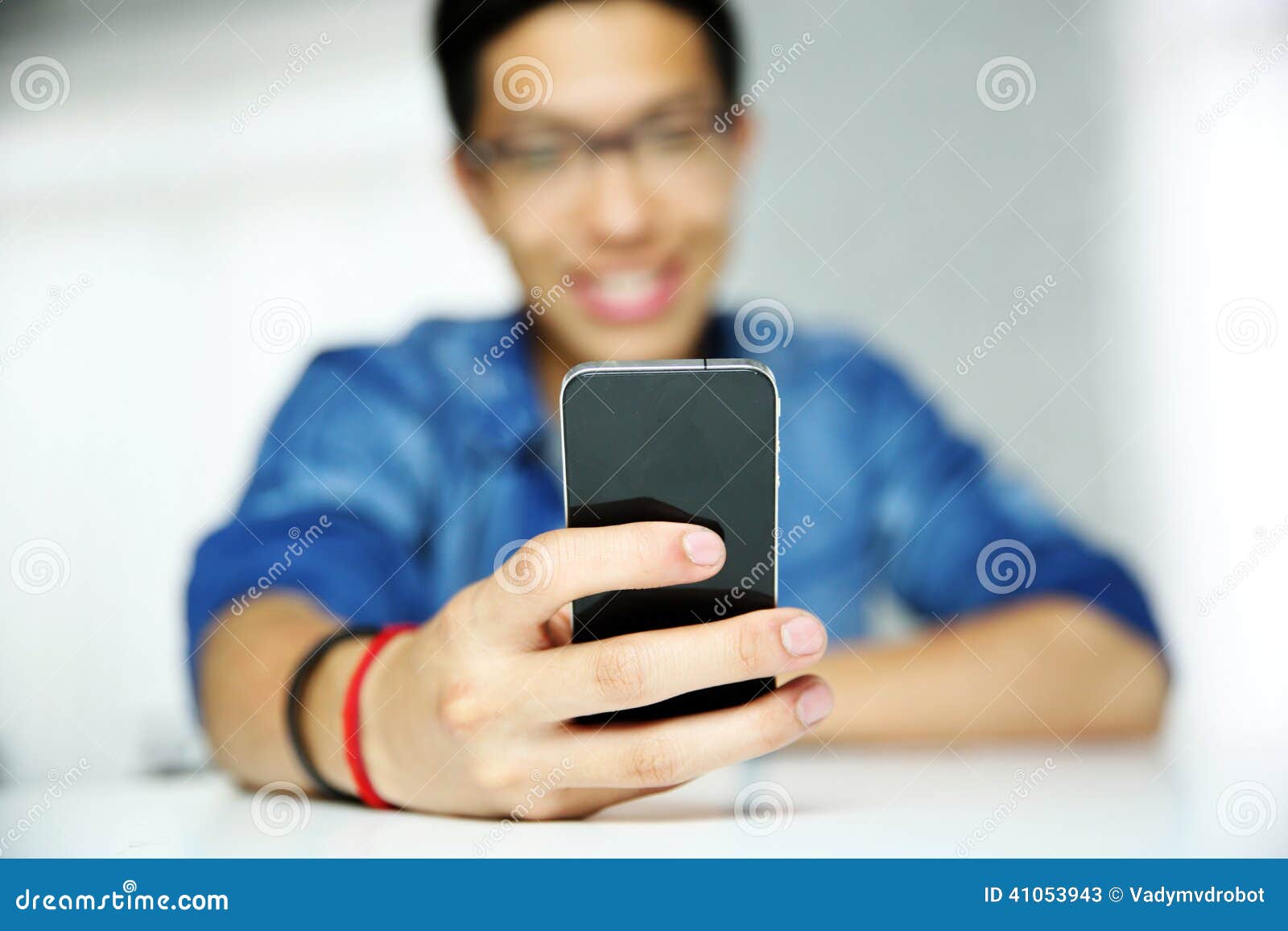 Man using smartphone. stock image. Image of hand, desk - 41053943